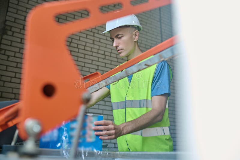 Experienced Warehouse Operator Using Automated Machinery for Packing ...