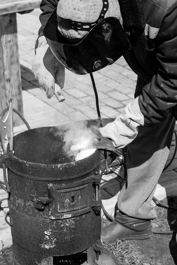 An Experienced Welder at Work. Preparation and Welding Process of Cast ...