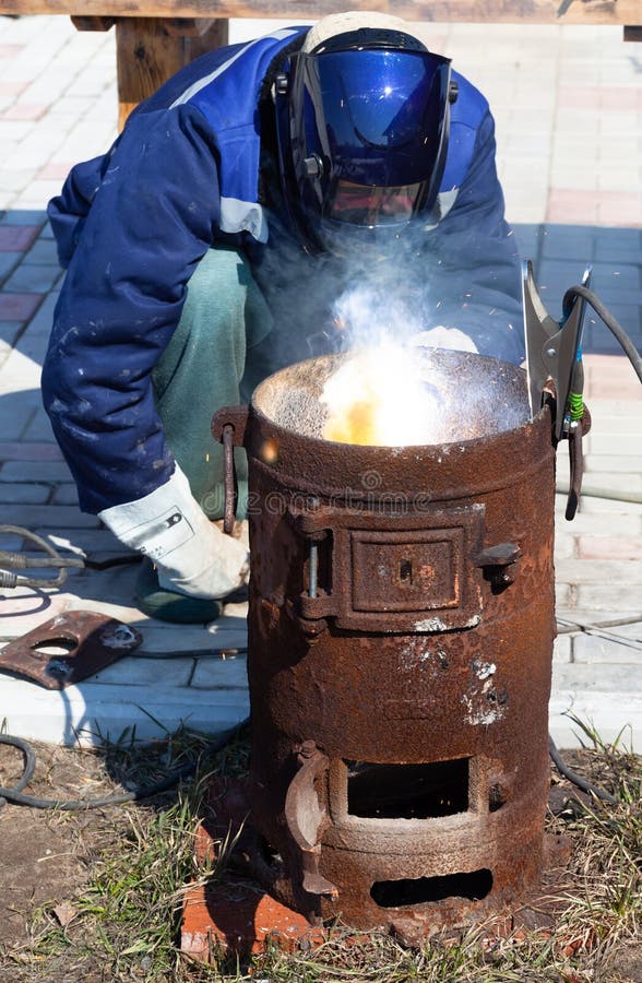 An Experienced Welder at Work. Preparation and Welding Process of Cast ...