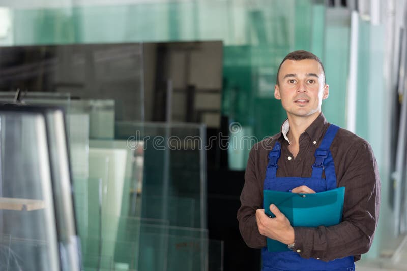 Experienced Worker Checks the Quality of Made Window Glass in an ...