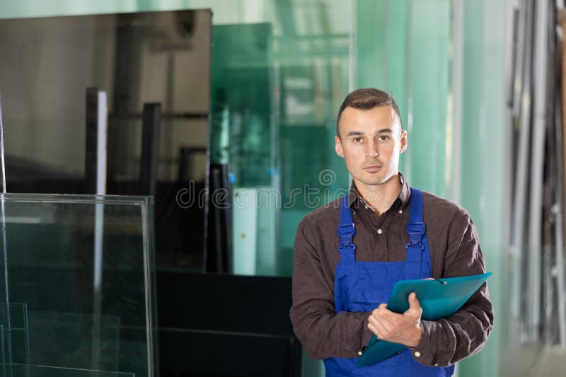 Experienced Worker Checks the Quality of Made Window Glass in an ...