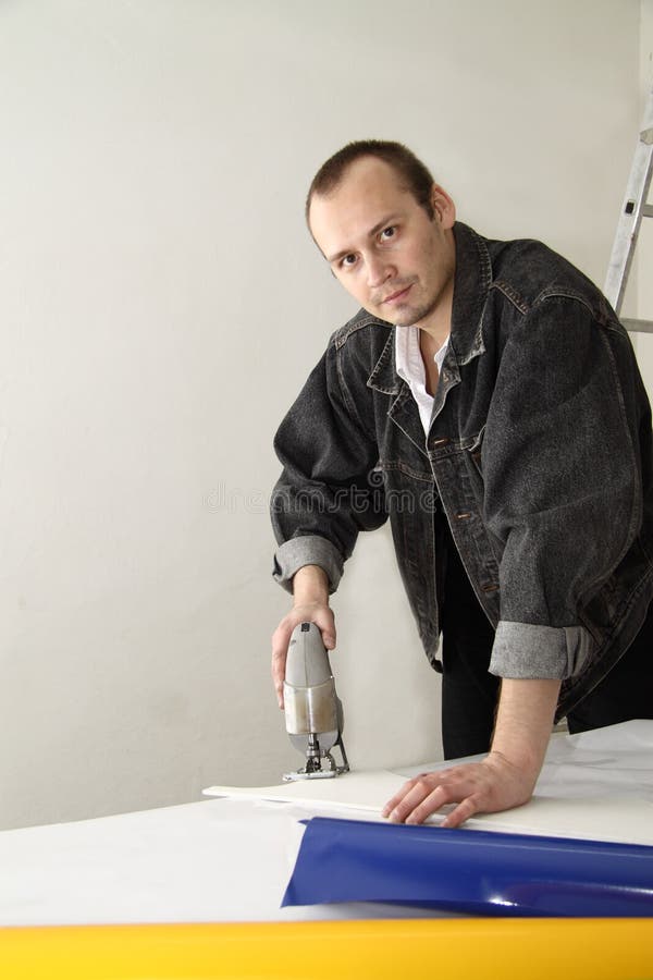 An Experienced Worker Does His Work with Jigsaws Stock Image - Image of ...