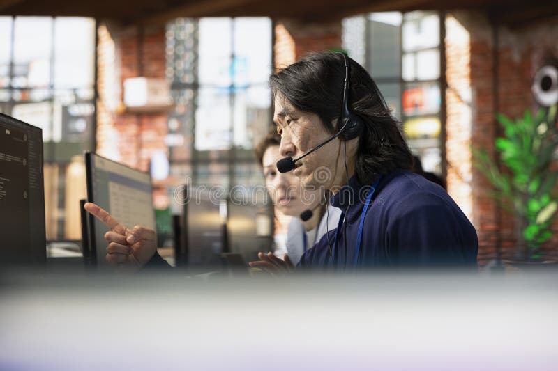 Experienced Worker Doing Customer Support Job Using PC To Troubleshoot ...