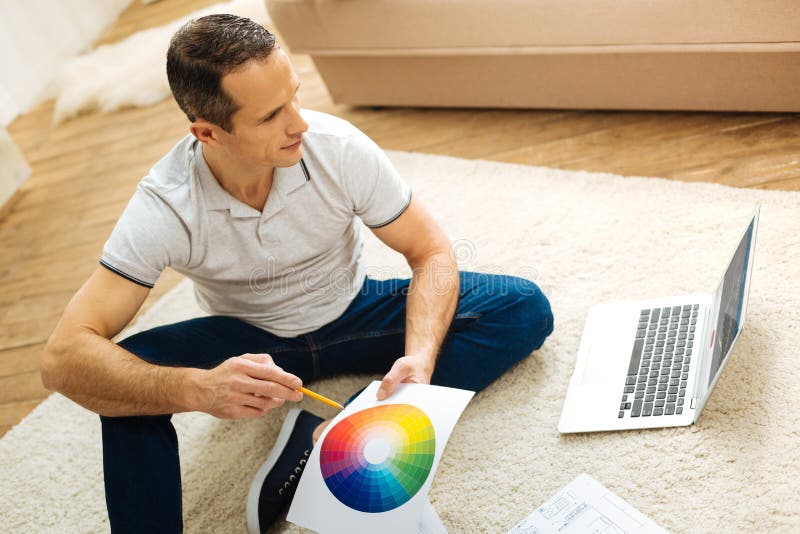 Creative Young Designer Looking into the Distance while Working on the ...