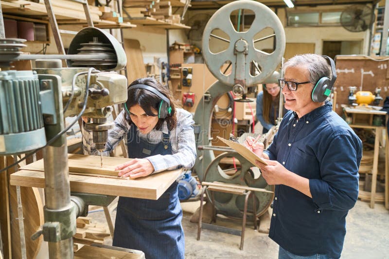 Experienced Worker Training Apprentice in Carpentry Workshop Stock Photo - Image of carpentry ...