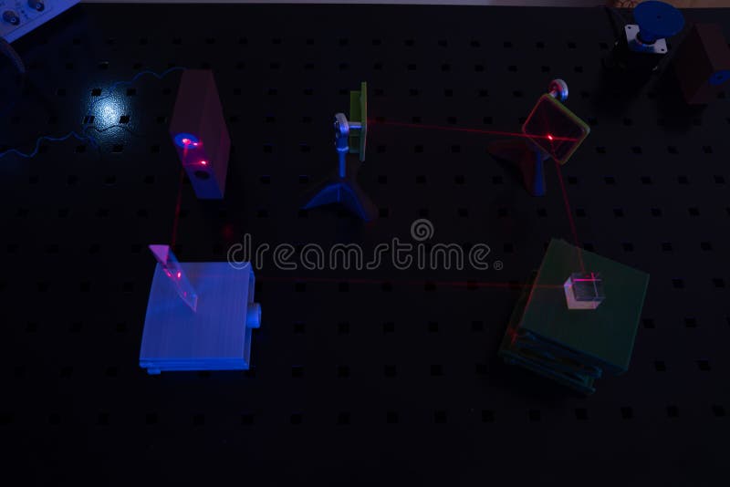 Experiment in Optic Lab with Laser Device. Red Laser on Optical Table ...