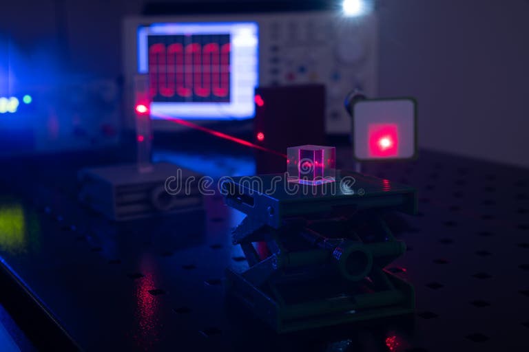 Experiment in Optic Lab with Laser Device. Red Laser on Optical Table ...