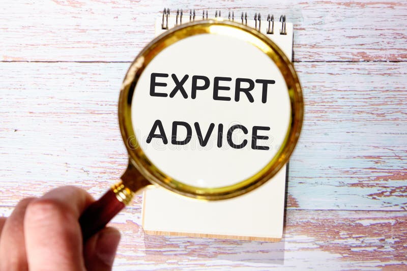 Expert Advice Text through a Magnifying Glass on a Notebook Stock Image ...