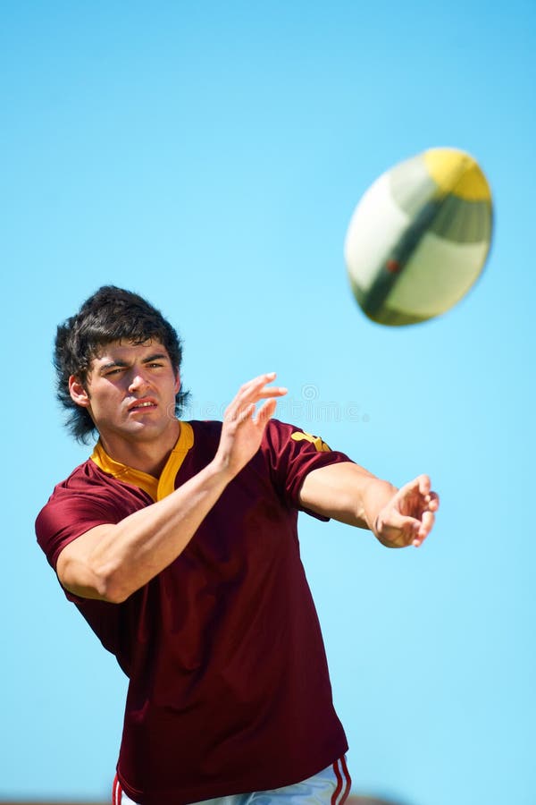 An Expert with the Ball. a Young Rugby Player Executing a Pass. Stock ...