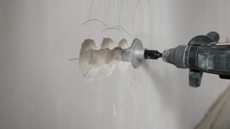 Expert Electrician Demonstrates Precision Drilling Techniques with a ...