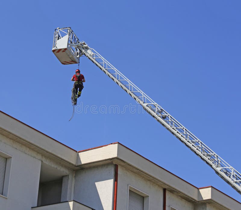 Expert Firefighter Down with the Rope in the Building during a F Stock ...