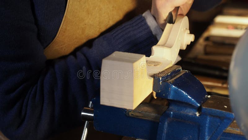 Expert Hands Carve a Violin Scroll by Hand, Showcasing the Dedication ...