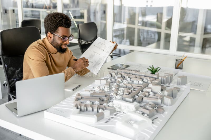 Expert Man Architect Drawing Blueprints in His Workplace Stock Photo ...