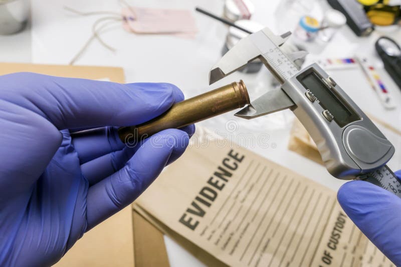 Expert Police Measures Bullet Caliber in Ballistic Lab Stock Photo ...