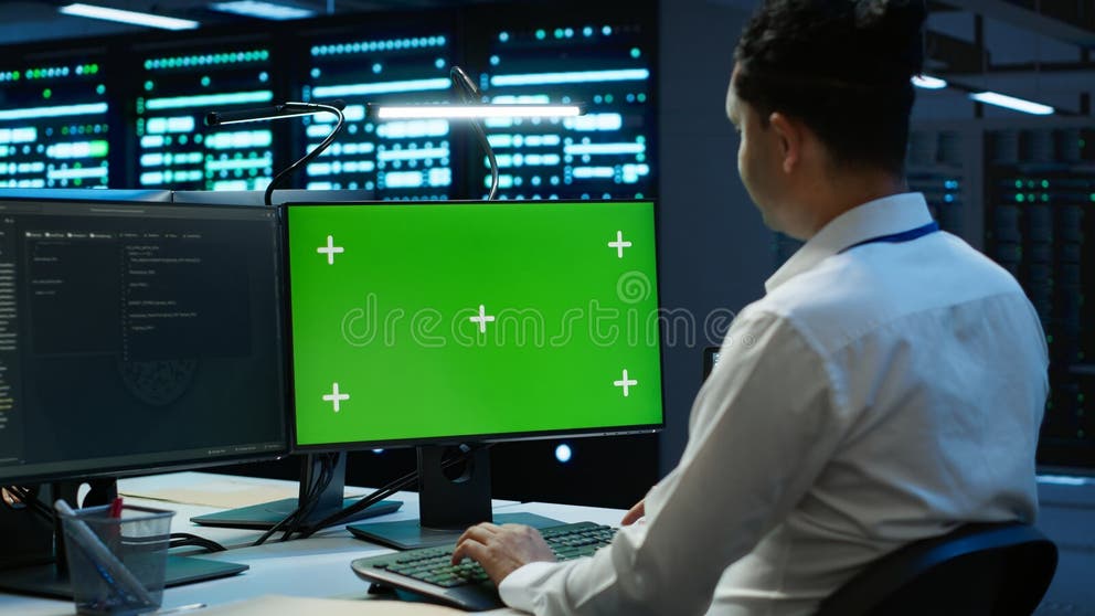Expert Updating Server Room Systems Using Green Screen Computer Stock ...
