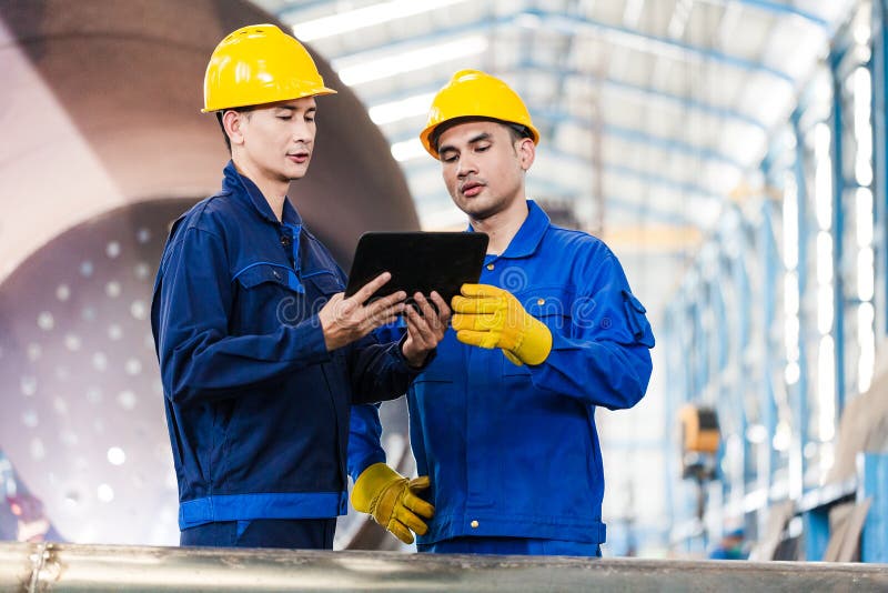 Experts Checking Information on Tablet PC in a Modern Factory Stock ...