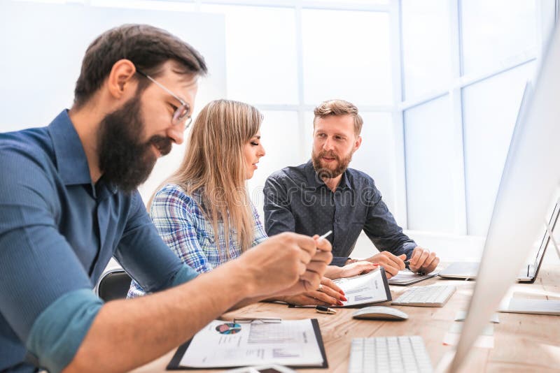 Experts Discussing Financial Documents at the Meeting Stock Photo ...