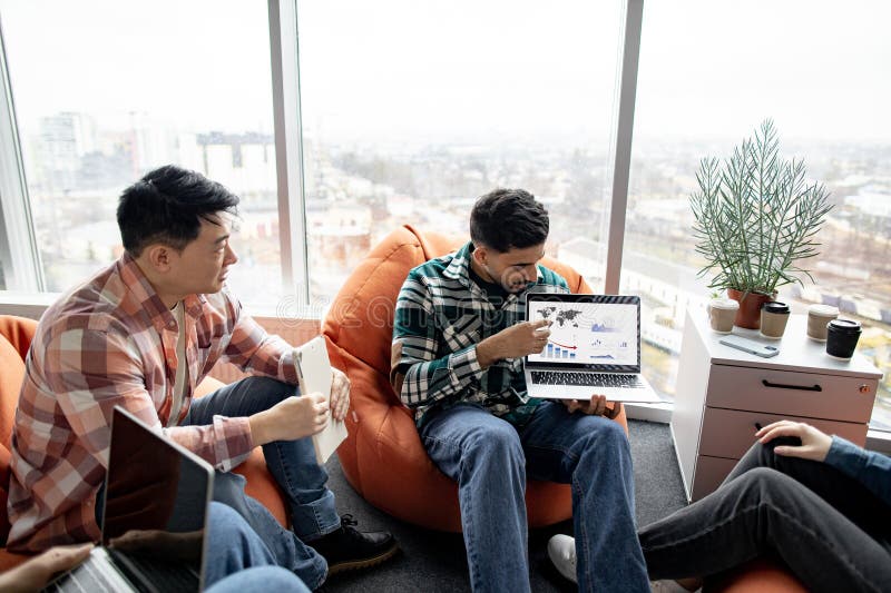 Experts Talking about Data on Computer in Office Interior Stock Photo ...