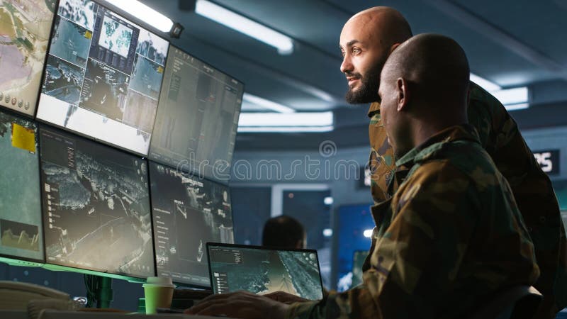 Experts Using Tracking Gear and Radar Systems in Command Center Stock ...
