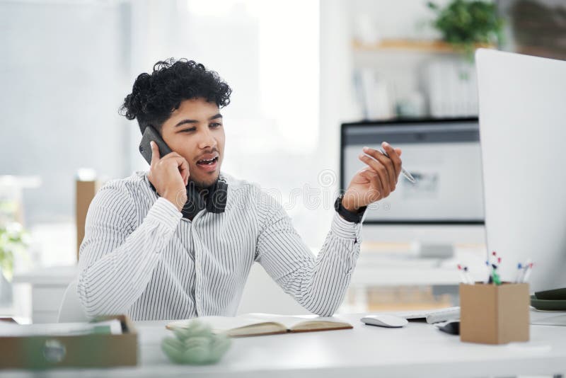 Explaining His Concept To a Client Over the Phone. a Young Businessman ...