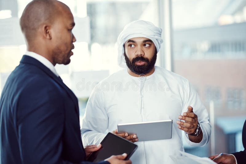 Explaining His Idea. a Group of Diverse Business Colleagues Working ...