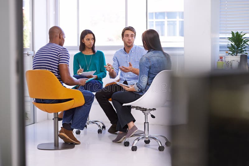 Explaining His Idea. a Young Group of Designers Having a Discussion ...