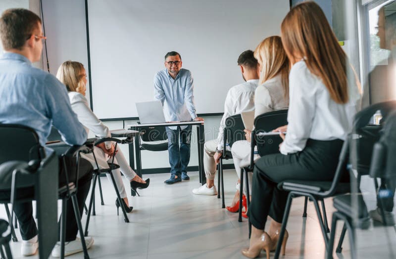 Explaining New Stuff for Students. Group of Professional Business ...