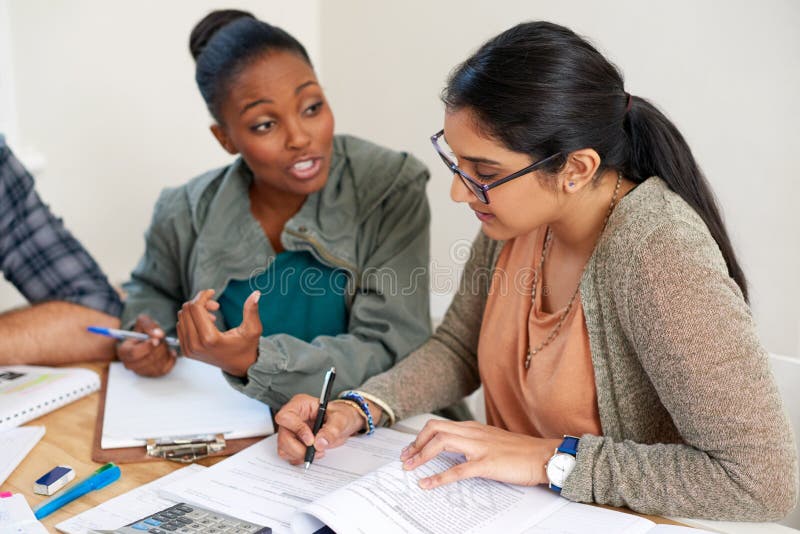 Explaining the Process. Three University Students Studying. Stock Image ...