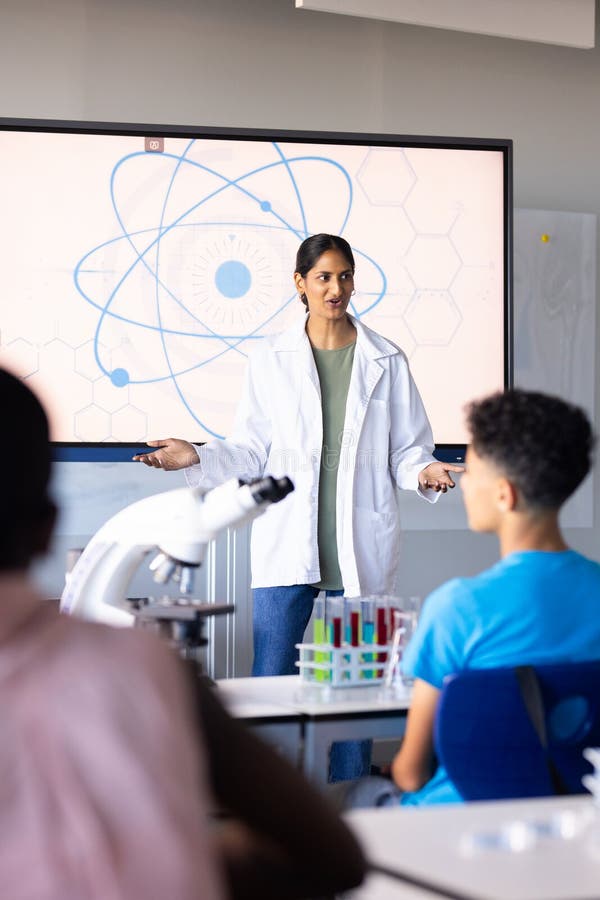 Explaining Science, Indian Female Teacher in School with Students ...