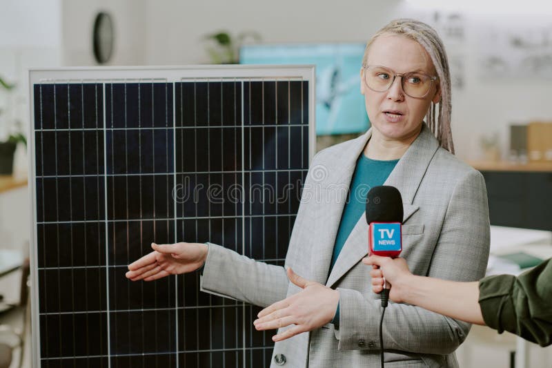 Explaining Solar Panel Benefits in Office Setting Stock Photo - Image ...