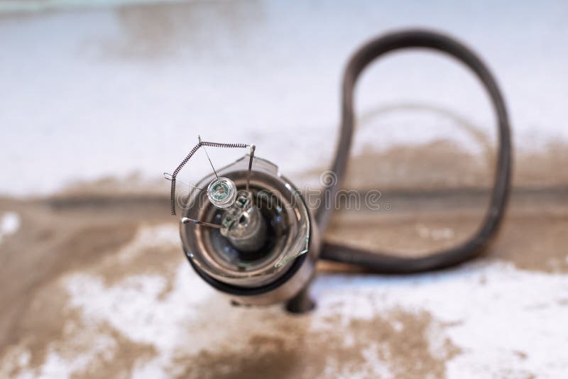 An Exploded Light Bulb in an Electric Socket Close-up. Electricity ...