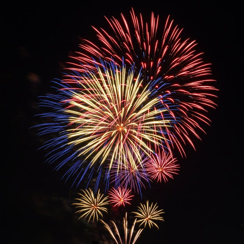 Exploding Fireworks Against a Dark Night Sky, with Vibrant Colors of ...