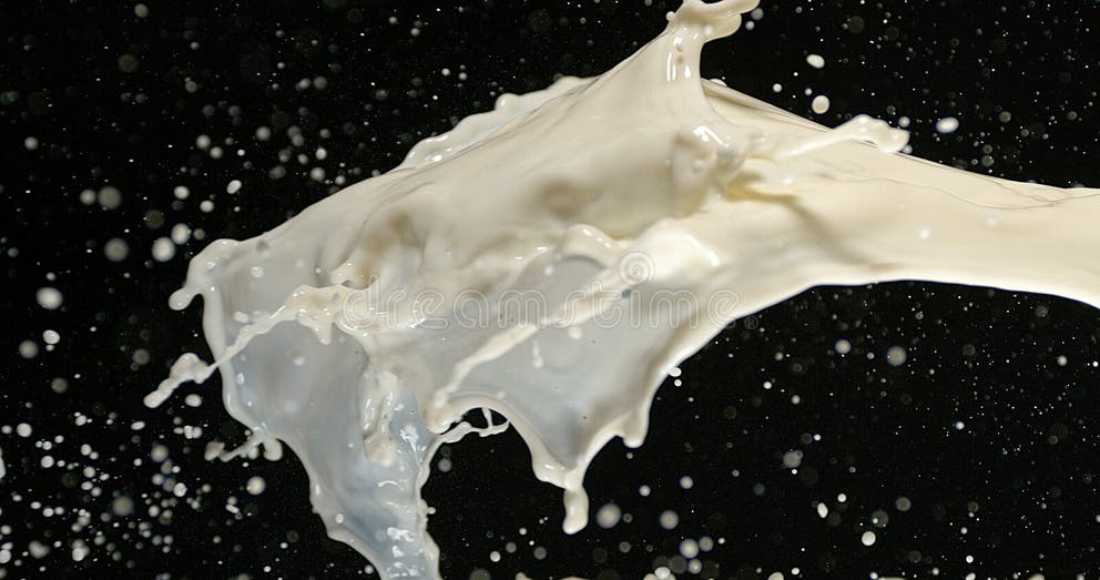 Exploding Milk Against Black Background Stock Photo - Image of concepts ...