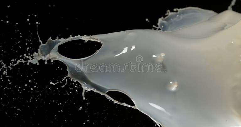 Exploding Milk Against Black Background Stock Photo - Image of flowing ...