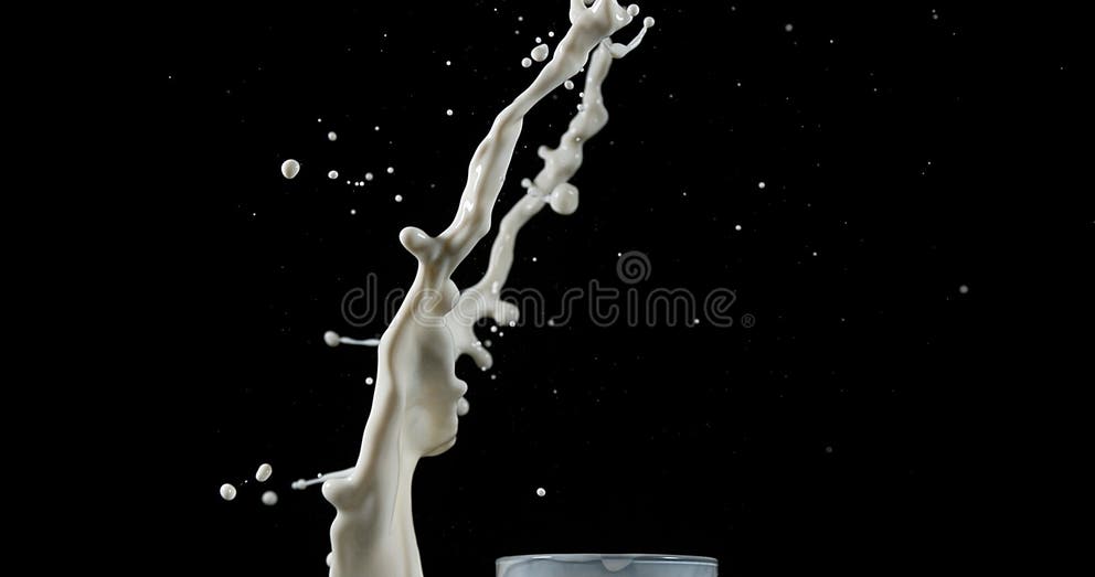 Exploding Milk Against Black Background Stock Photo - Image of milk ...
