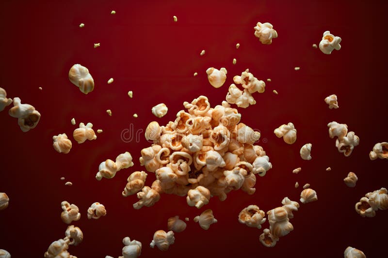 Exploding Popcorn Kernels Captured Mid Air Against a Vivid Red ...