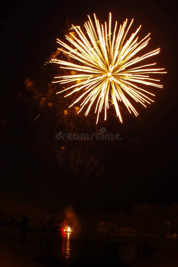 Exploding Round Yellow Firework in Black Night Sky with Copy Space ...