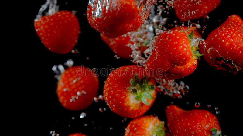 Exploding Strawberries with Water on a Black Background. Stock Video ...