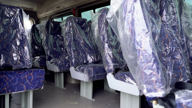 Explore the Cozy Interior of the Minibus with New Plastic-wrapped Seats Stock Footage - Video of ...