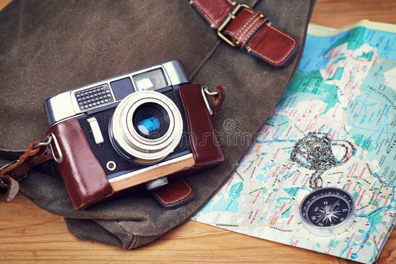 Explore, Dream, Discover. a Camera, Map, Compass and Bag on a Wooden ...