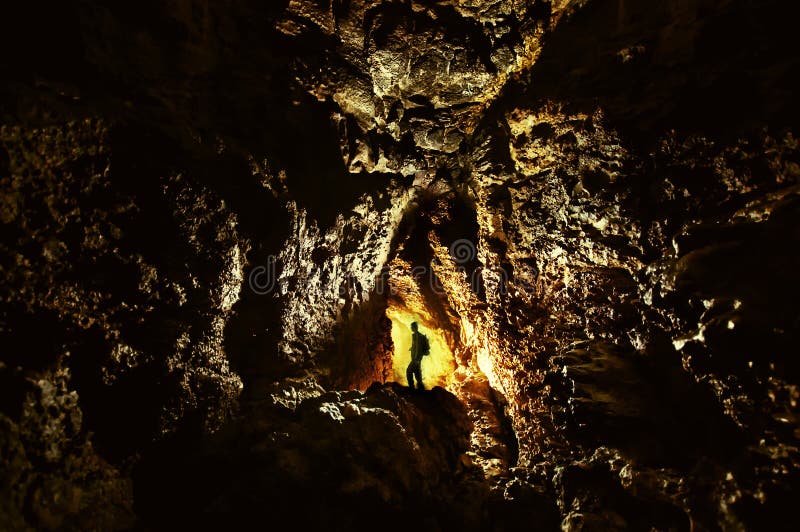 Explorer in Cave with Light Stock Image - Image of ground, deep: 39425675