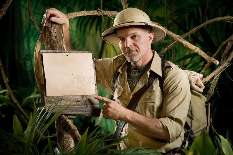 Explorer Pointing To a Sign Stock Image - Image of exploration ...