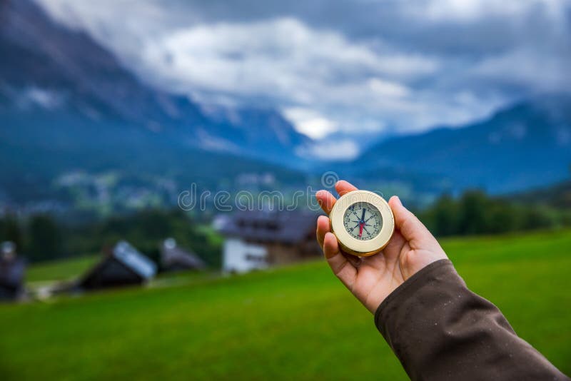 Explorer Searching Direction with Compass in Summer Mountains, P Stock ...