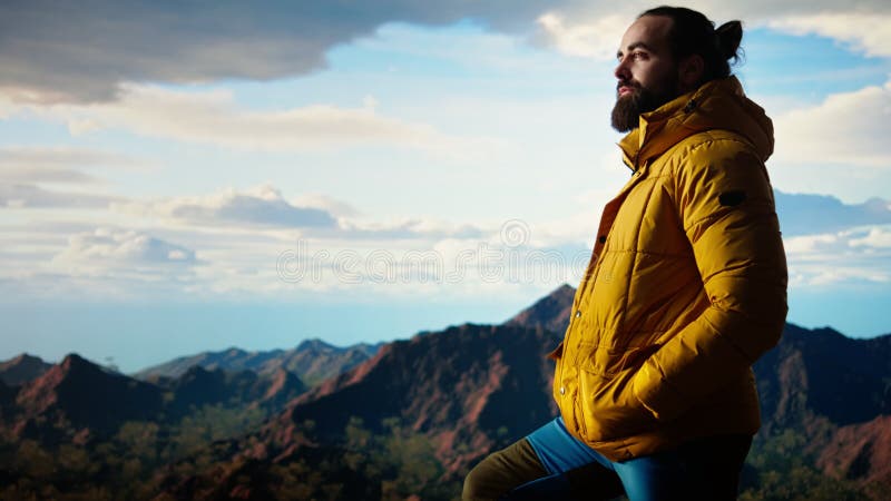 Explorer Stands on a Mountain Peak Taking in the Fresh Air and ...