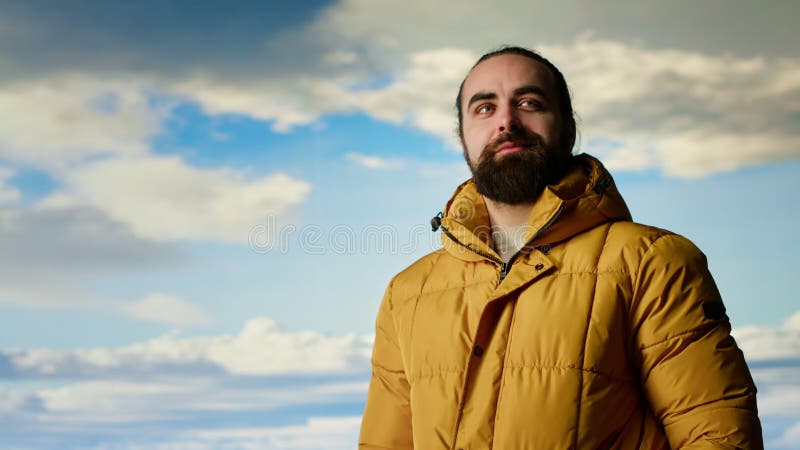 Explorer Stands on a Mountain Peak Taking in the Fresh Air and ...