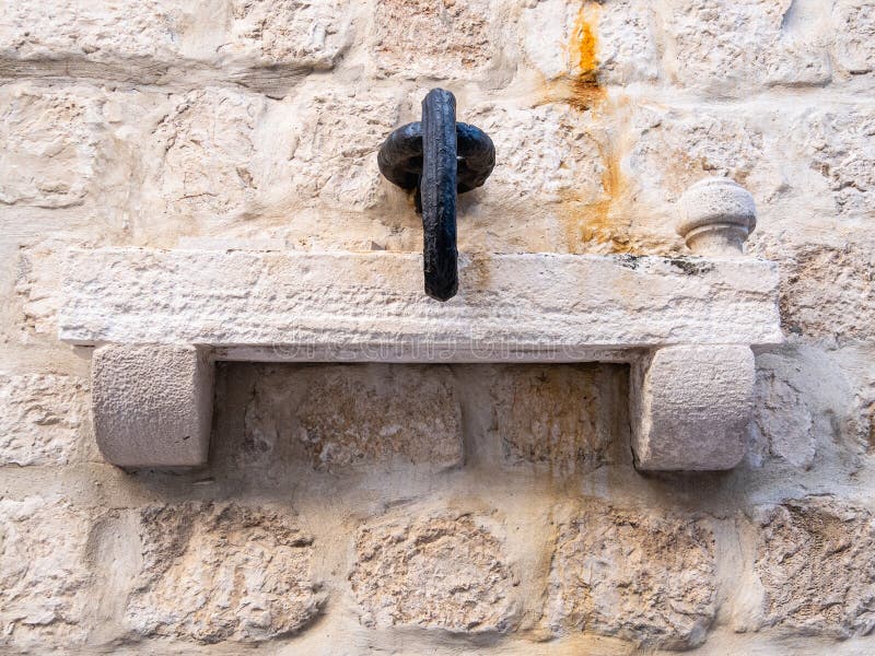 Exploring Ancient Architecture: Iron Cast on Stone Shelf Stock Image ...