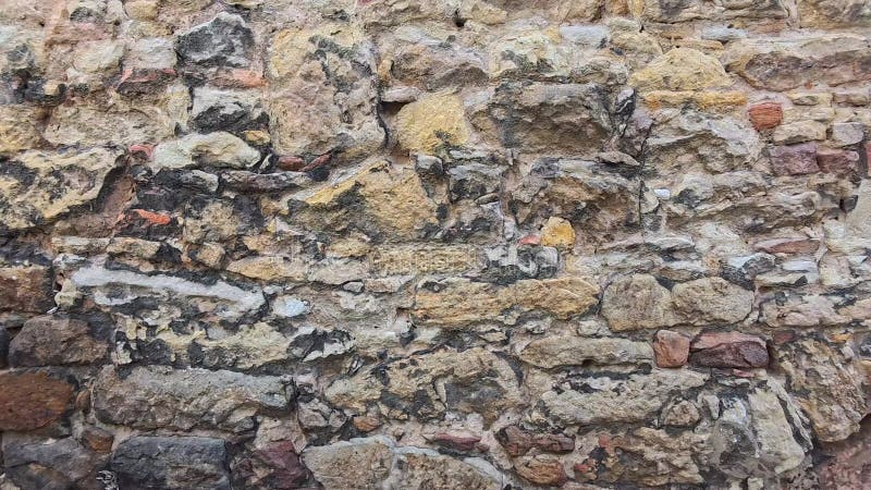 Exploring the Ancient Stone Wall Structure in a Historic Urban Setting ...