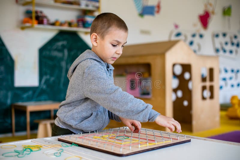 Exploring Basic Math and Geometry Concepts with Geoboard Stock Photo ...