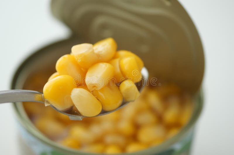 Exploring Canned Corn with a Spoon in a Kitchen Setting Stock Image ...