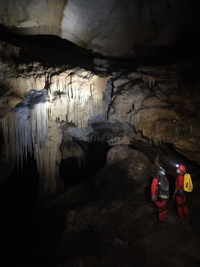 Cave exploring stock photo. Image of lamp, limestone - 15453588